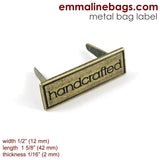 Metal Bag Label: "Handcrafted" with Border - Emmaline Bags Inc.